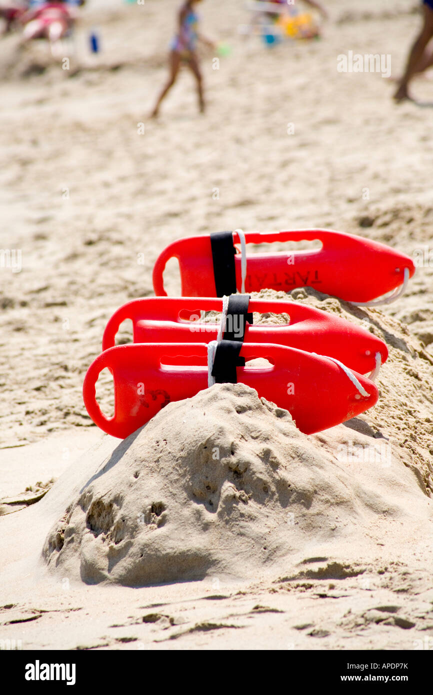 A view of lifeguard rescue cans on a beach by the ocean Stock Photo - Alamy