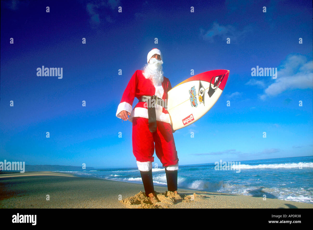 Surfing Santa with surfboard, Gabe Davies, Hawaii, USA Stock Photo - Alamy