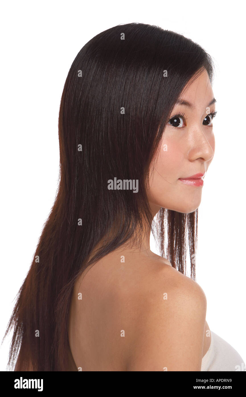 Young woman smiling turning head side view close up Stock Photo - Alamy