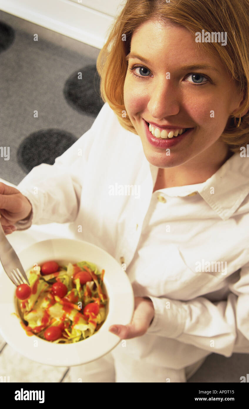 Woman salad cherry tomatoes vertical hi-res stock photography and images - Alamy