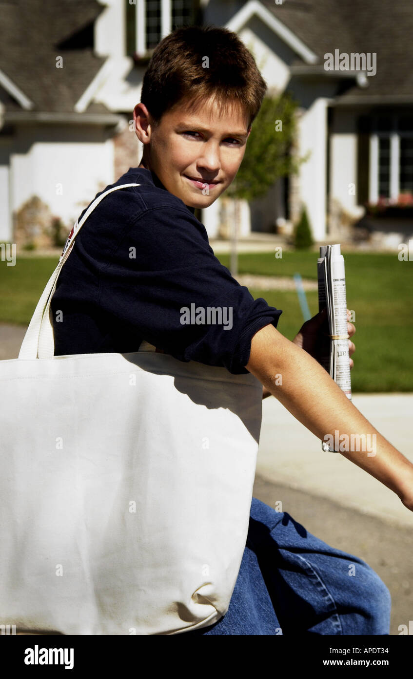 Kid bike delivering newspaper hi-res stock photography and images - Alamy