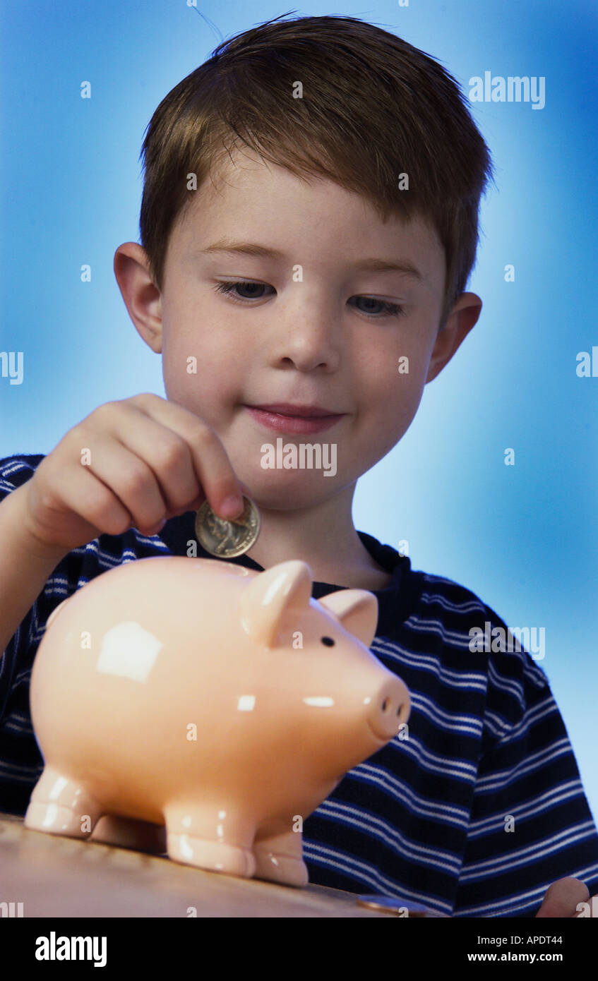 Boy with piggy bank Stock Photo - Alamy