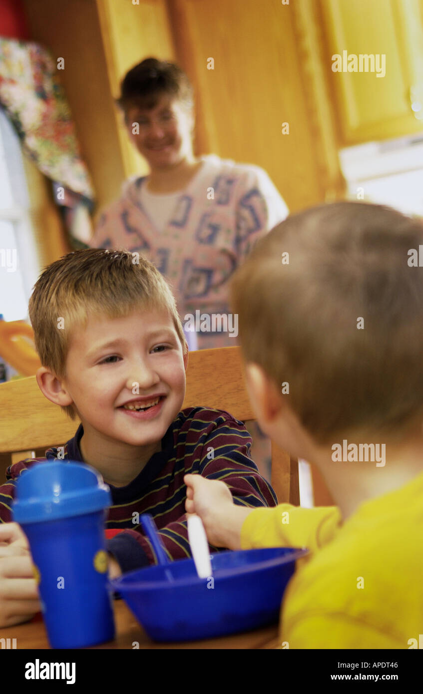 Boys eating breakfast Stock Photo - Alamy