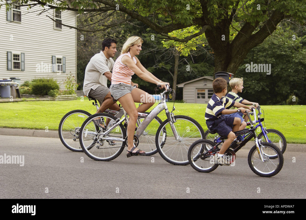 Family on a bike ride Stock Photo - Alamy