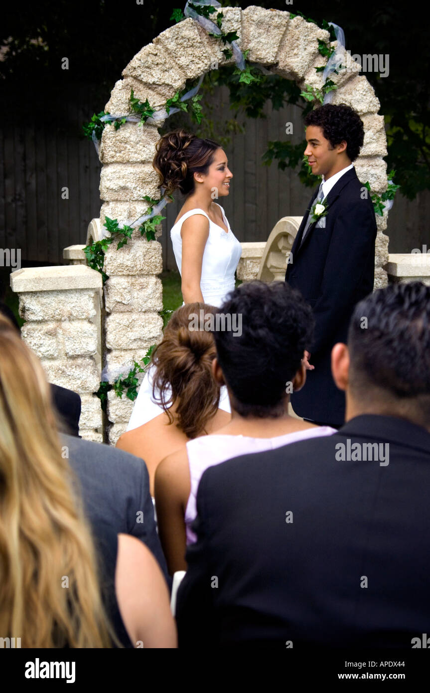 Bride and Groom at altar Stock Photo - Alamy