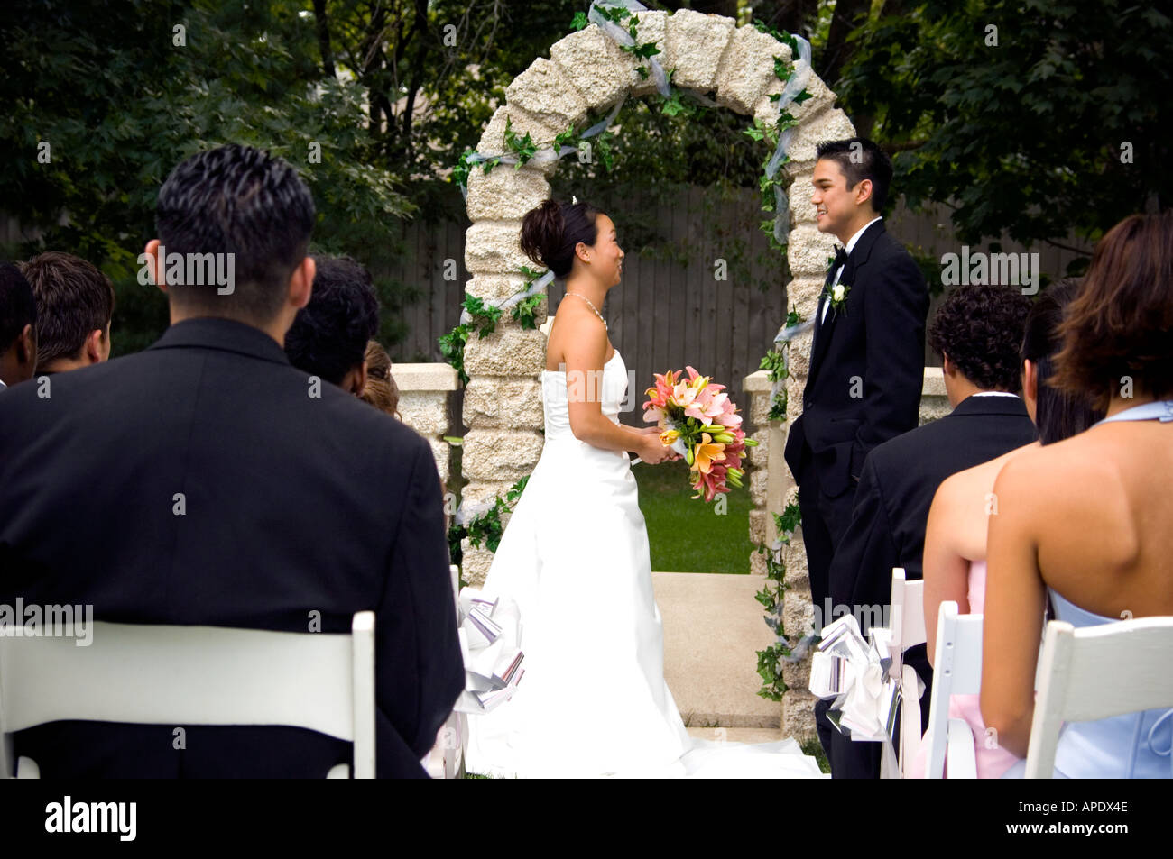 Bride and Groom at altar Stock Photo - Alamy