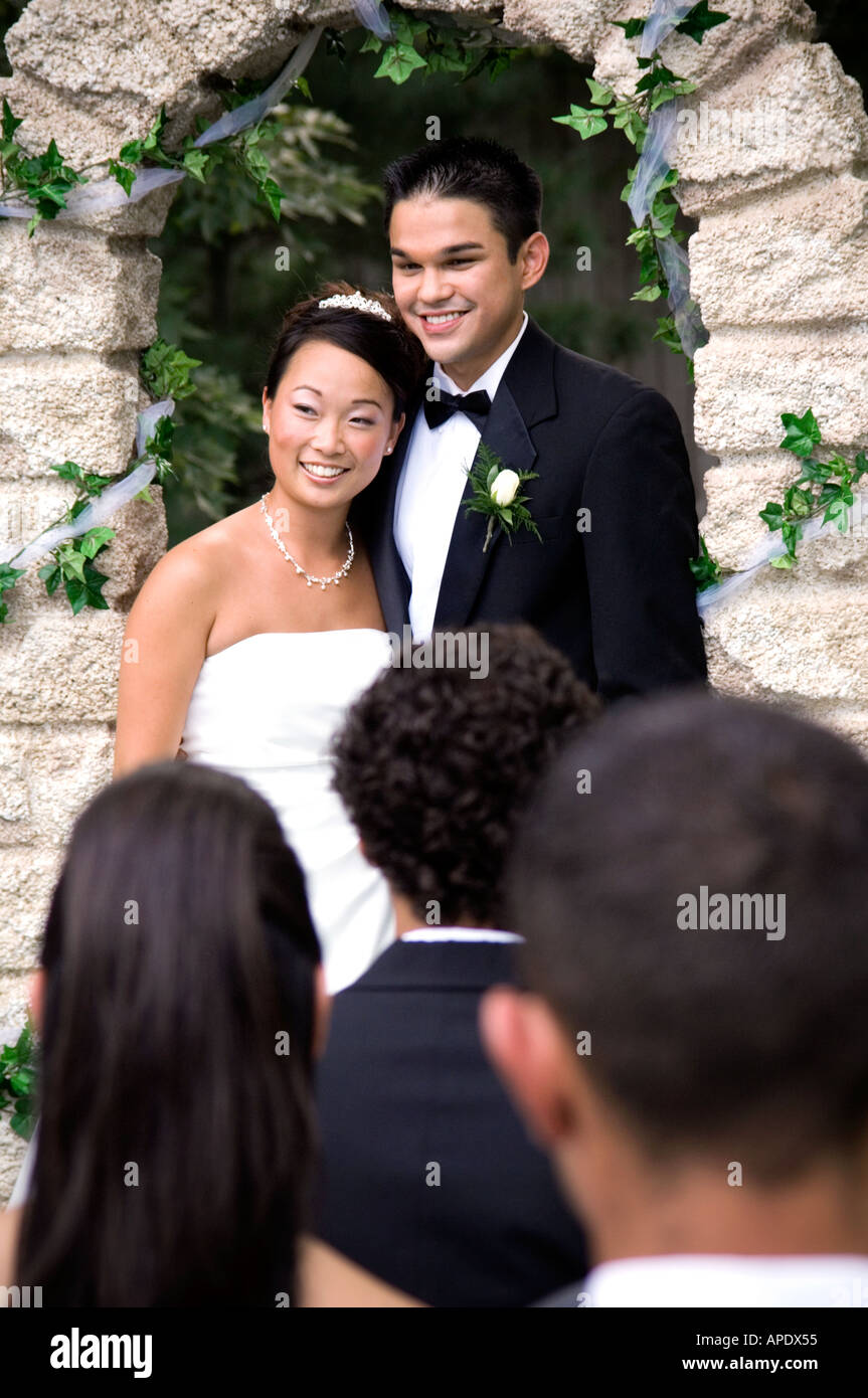 Bride and Groom at altar Stock Photo - Alamy