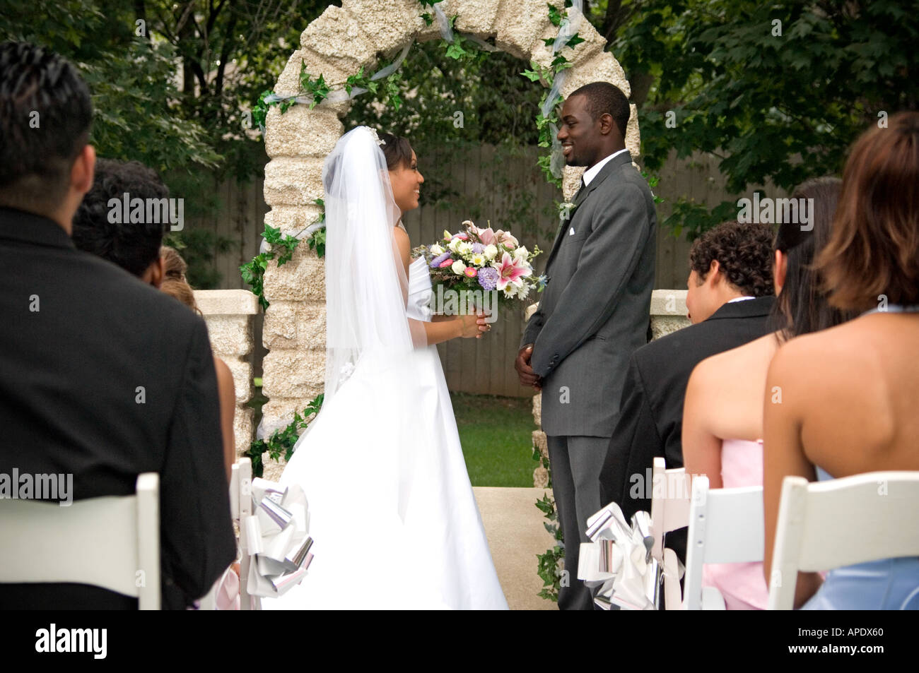 Bride and Groom at altar Stock Photo - Alamy