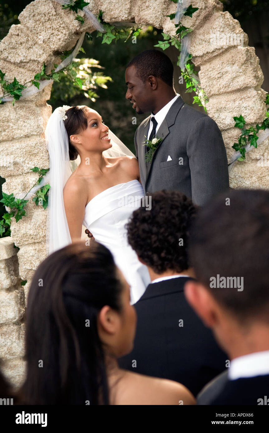 Bride and Groom at altar Stock Photo - Alamy