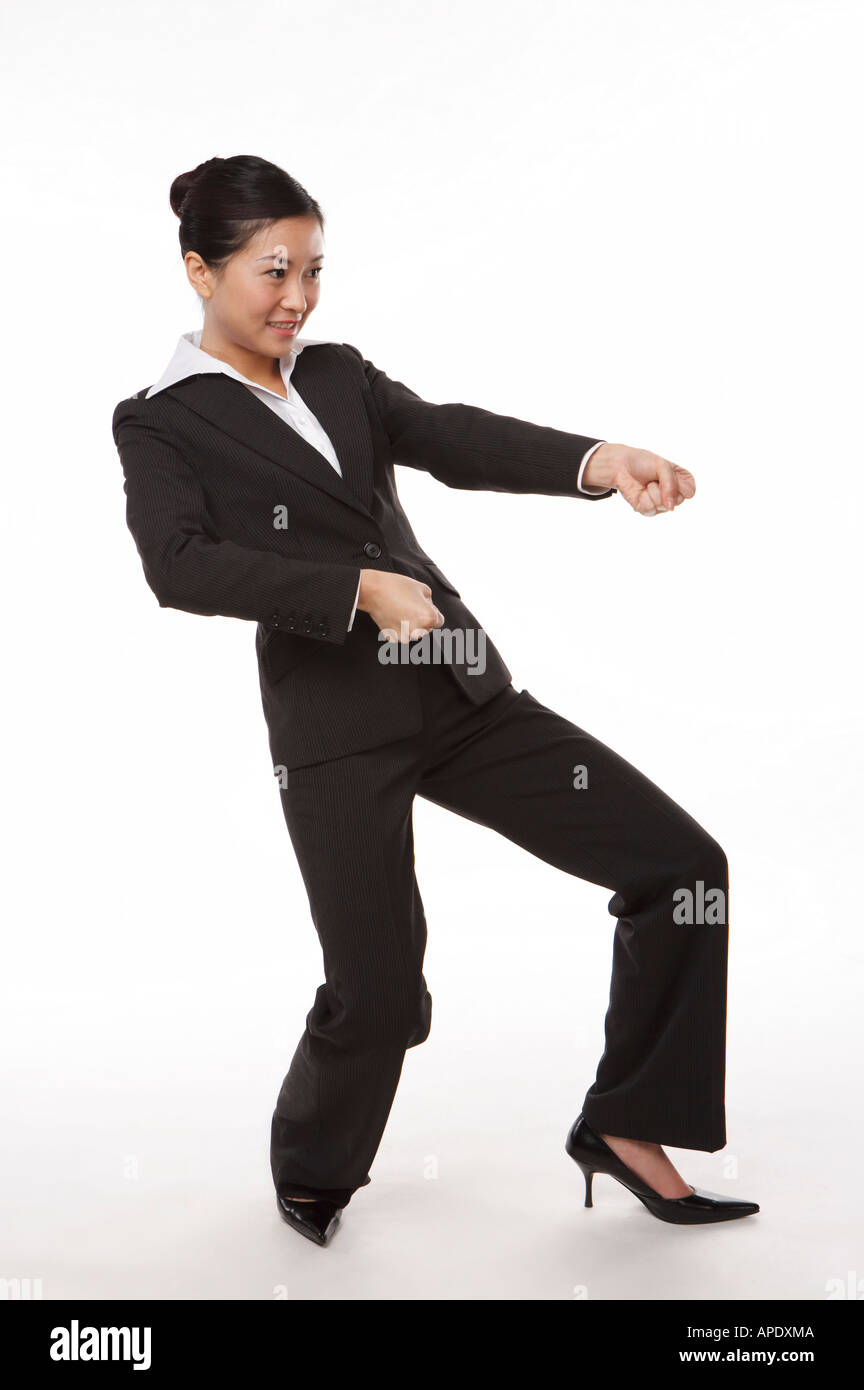 Young woman in business suit pulling something Stock Photo - Alamy