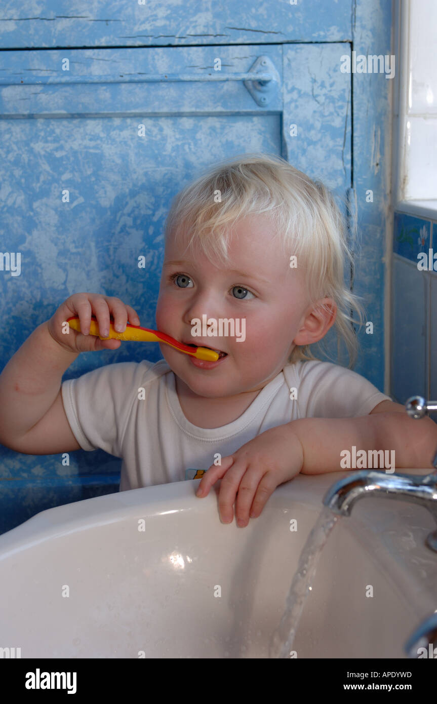 Child Brushing Teeth With Water