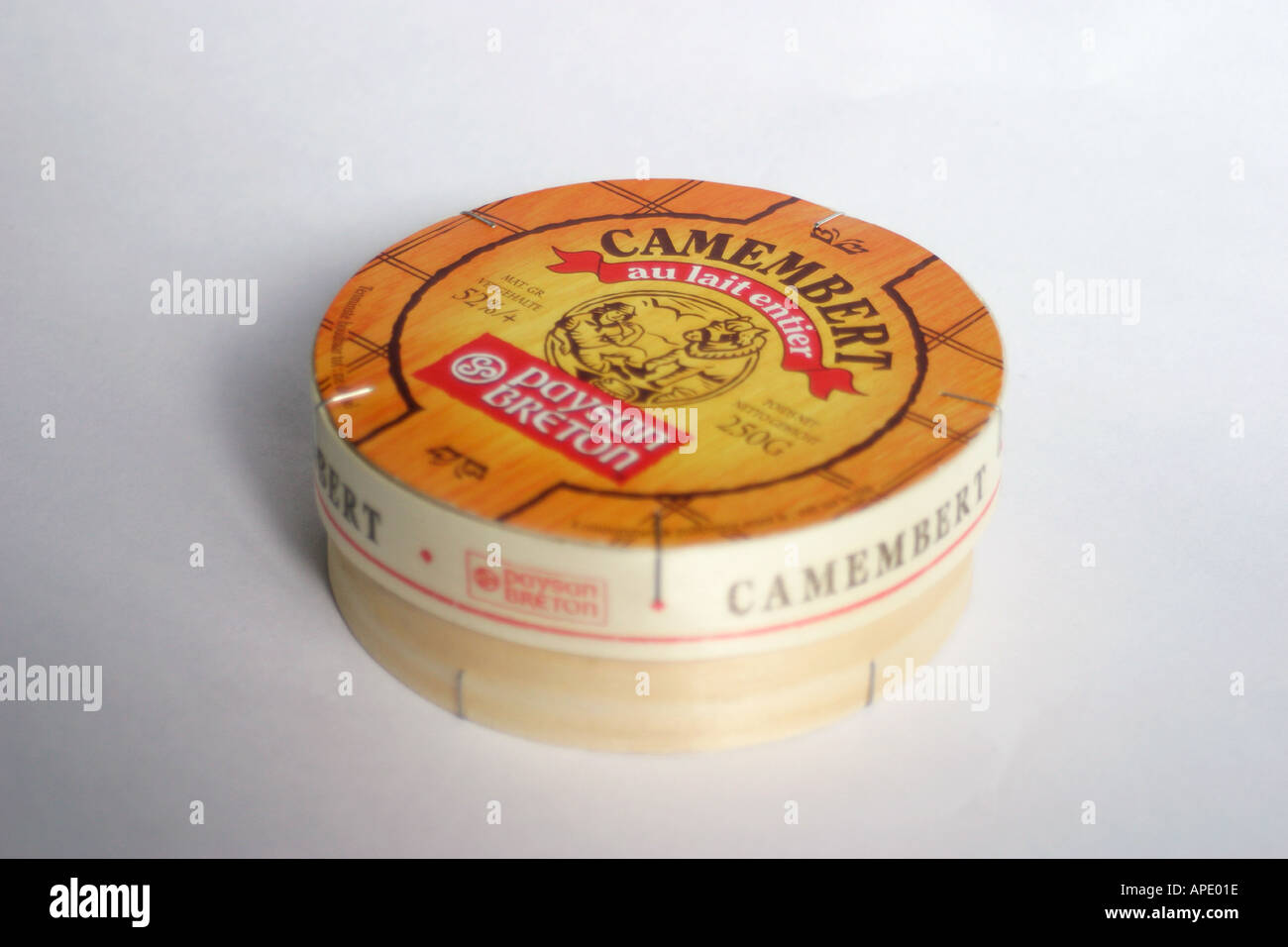 Small Camembert cheese in individual box with lid on on white ...
