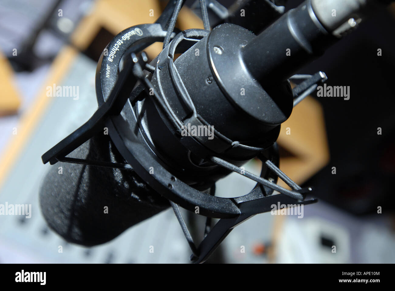 a dj microphone at a radio station mixing desk Stock Photo - Alamy