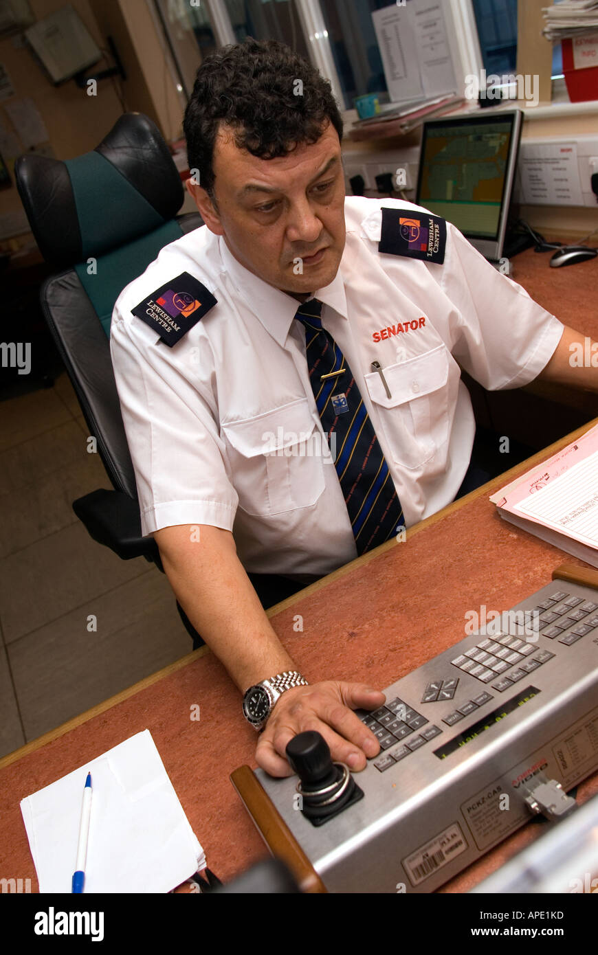 Security guard on duty in CCTV control room Stock Photo - Alamy