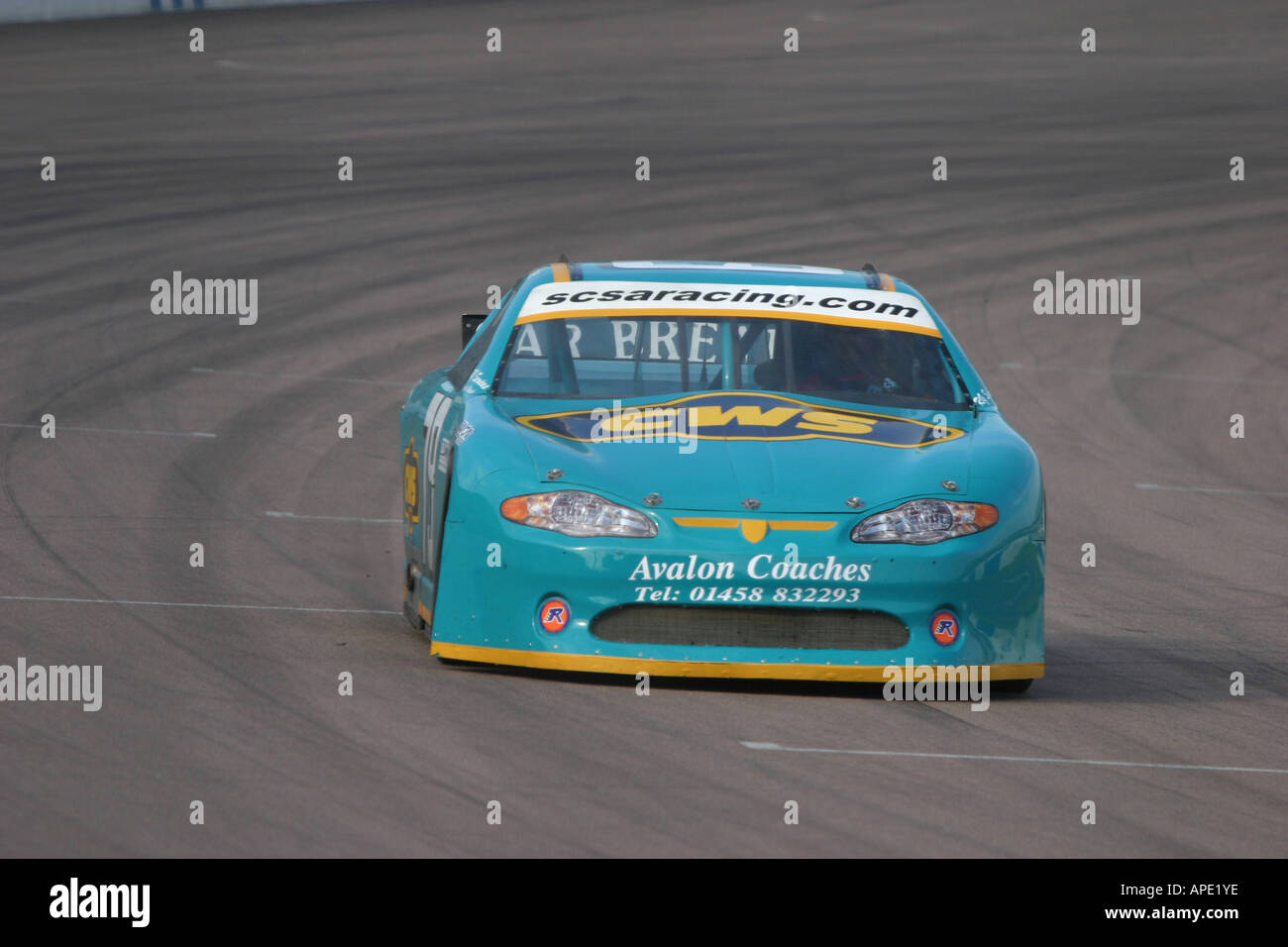 V8 Nascar type stock cars racing on a banked oval circuit Stock Photo ...