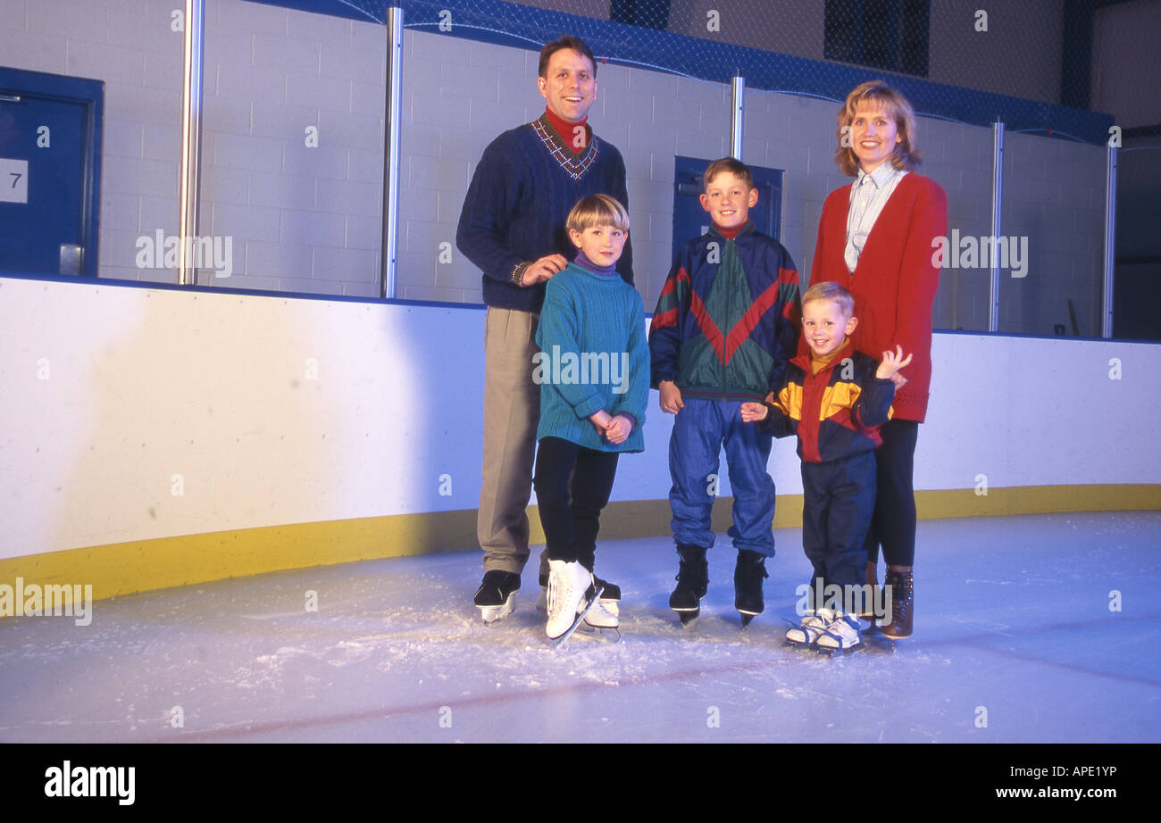 family poses at ice skating rink Stock Photo - Alamy