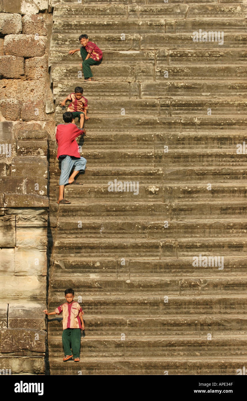 Climbing down steps at Angkor Wat Stock Photo - Alamy