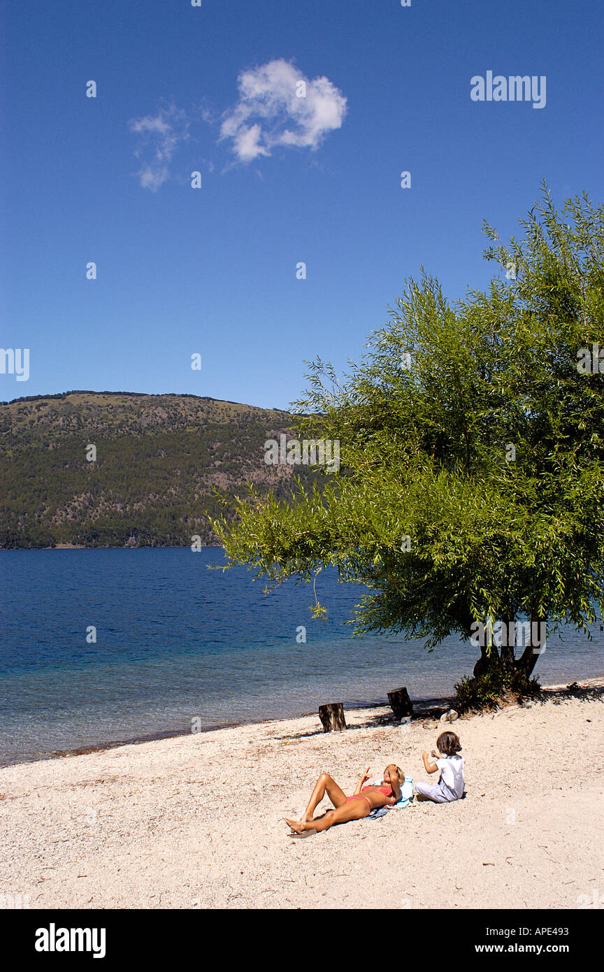 Woman beach taking beach sun tanning hi-res stock photography and ...