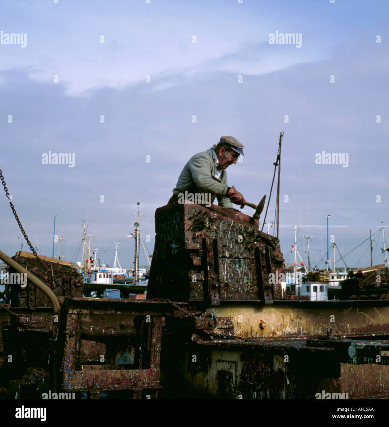 Ship repair and maintenance; a shipwright preparing a slipway cradle ...