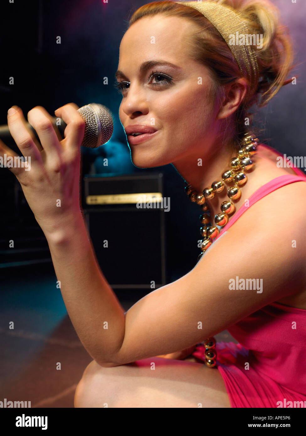 Young Woman Singing on stage in Concert, close up, side view Stock ...