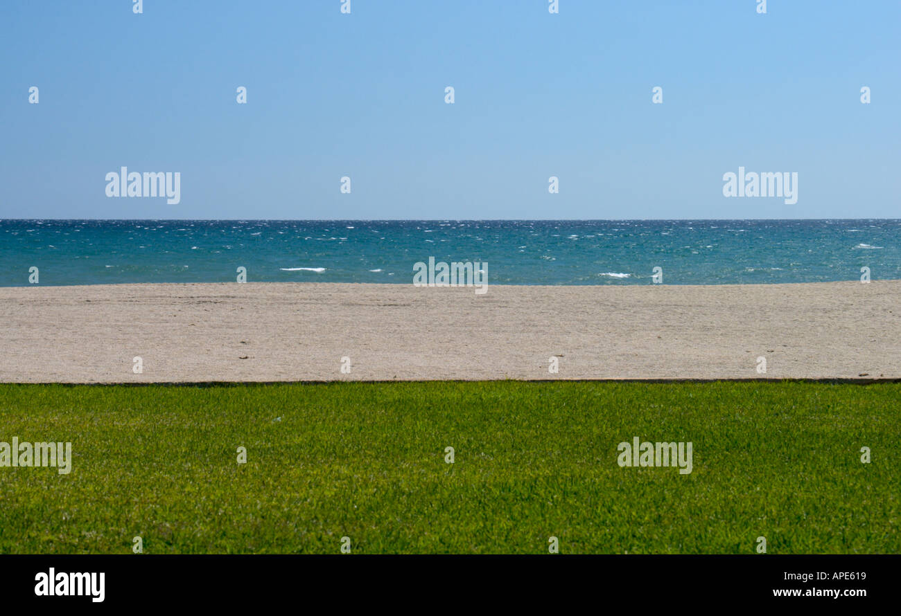 Sky sea sand and grass Stock Photo - Alamy