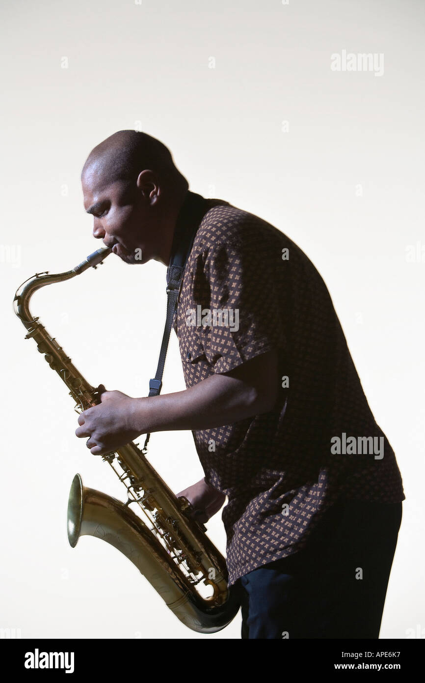 Man Playing Saxophone, side view Stock Photo - Alamy
