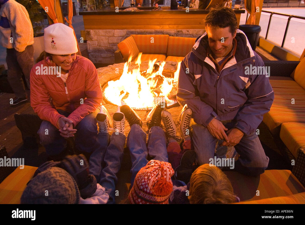 Family Sitting Around Fire High Resolution Stock Photography and Images ...