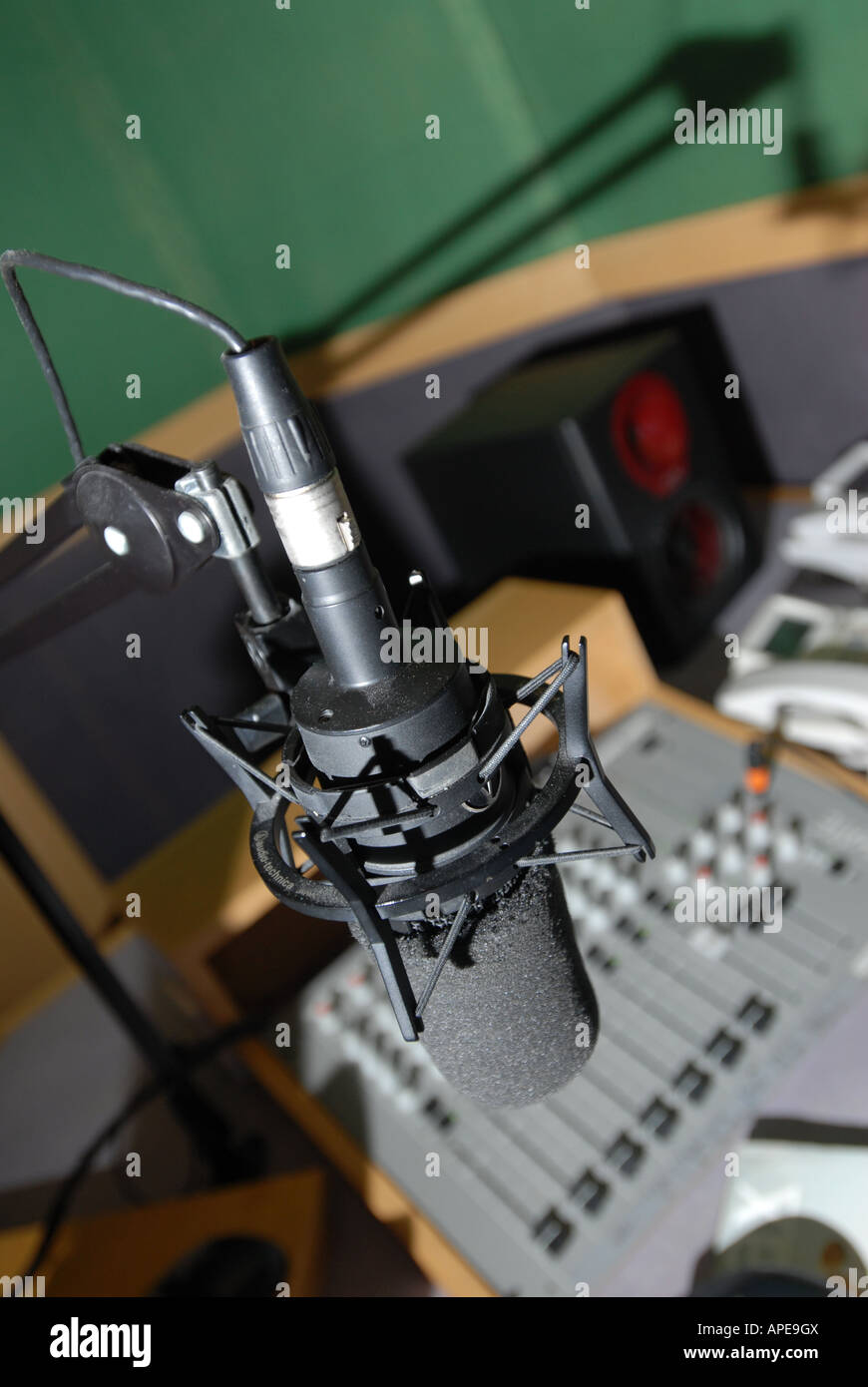 a dj microphone at a radio station mixing desk Stock Photo - Alamy