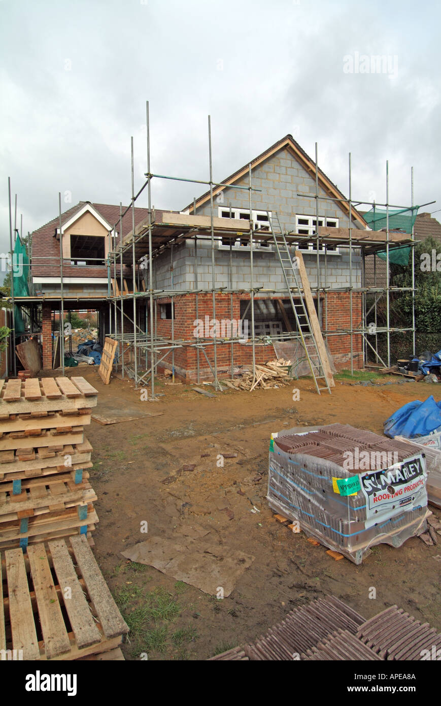 Detached house roof covering of Marley concrete plain tiles work in ...