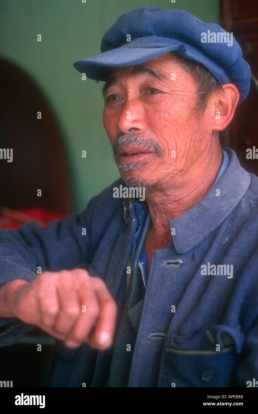 Chinese man in the tradional blue suit Stock Photo - Alamy