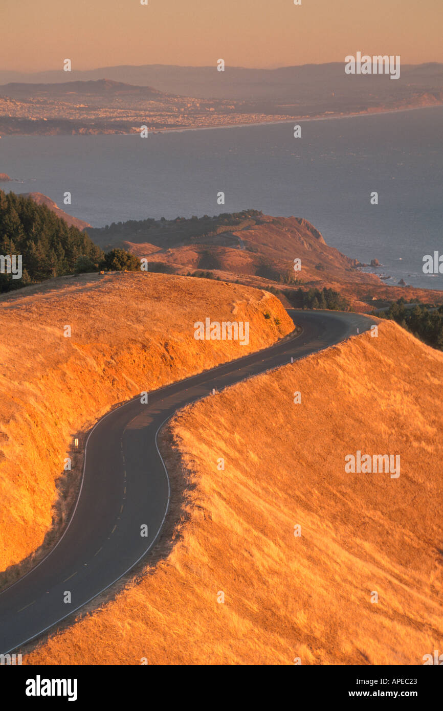 Twisting curves on mountain road and golden grass at sunset Mount ...