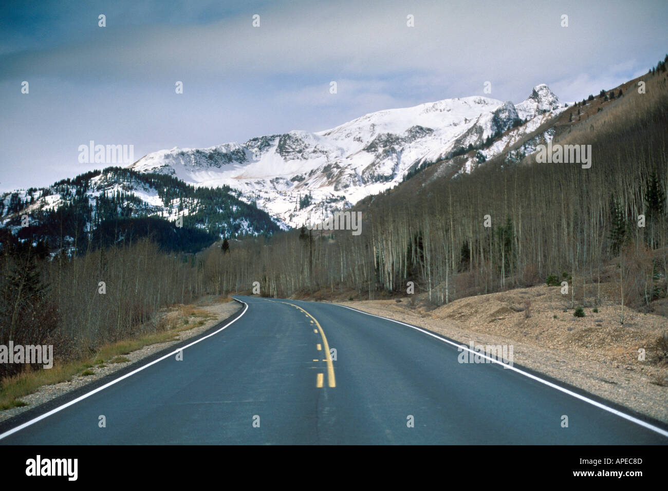 State Route rural Highway 550 through snow topped mountains in late ...