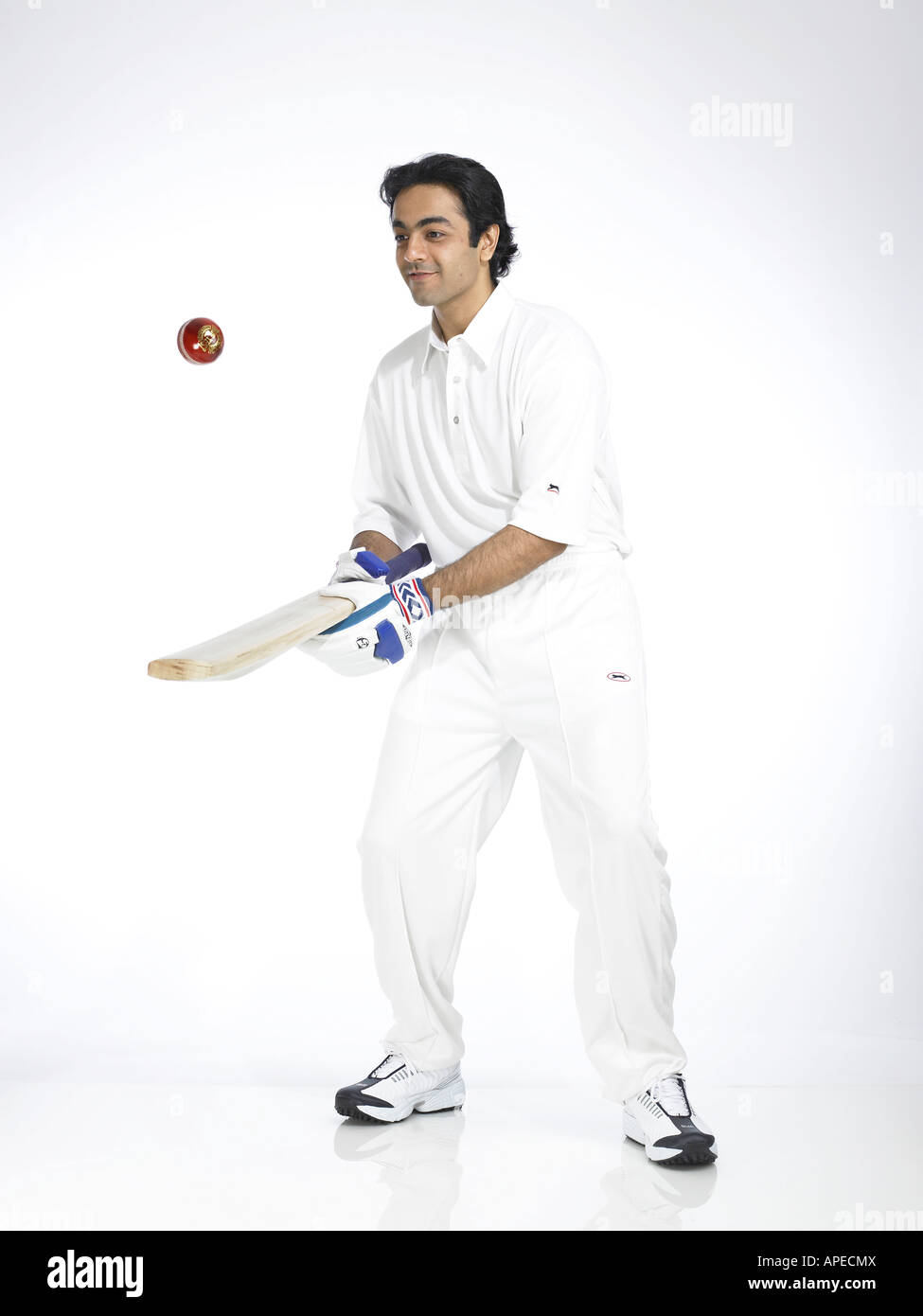 Indian batsman bouncing ball in air with bat Stock Photo - Alamy
