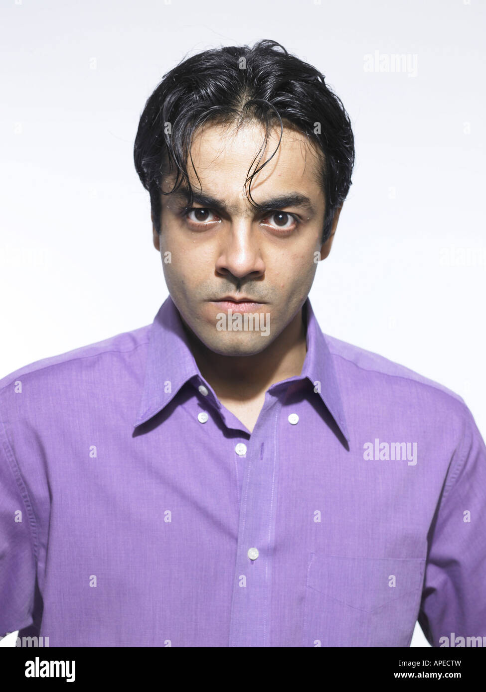 Close up of South Asian Indian man showing angry facial expression ...