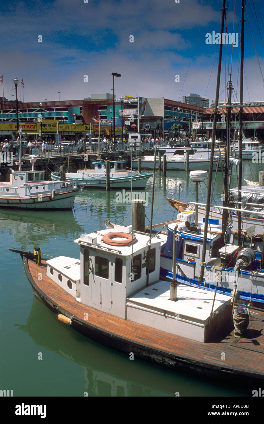 Commercial marine fishing boats and trawlers docked at pier at ...