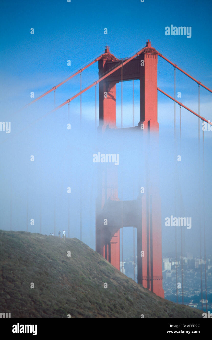 Coastal marine layer fog shrouds north tower Golden Gate Bridge from ...