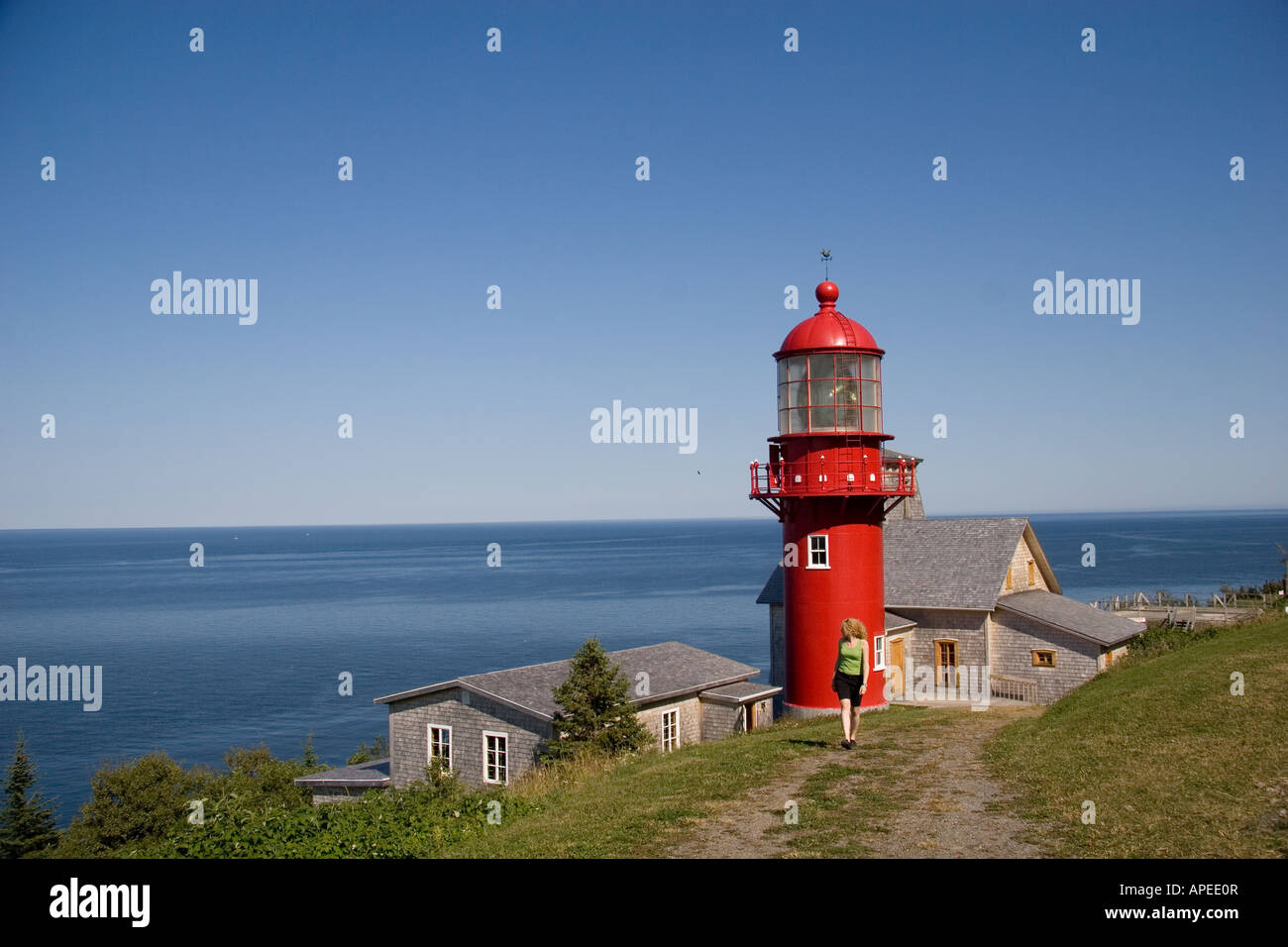 A lighthouse on the coastline of the Gaspe Peninsula in summer Stock ...