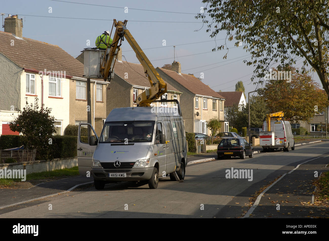 maintenance worker working on street lighting using a cherry picker ...