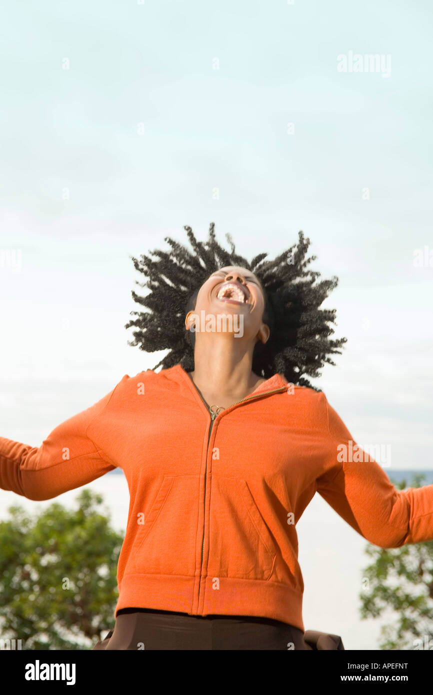 African woman laughing with head back Stock Photo - Alamy
