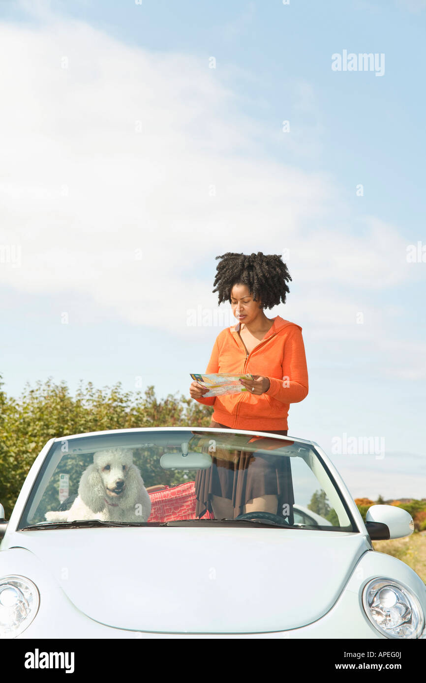 African woman reading map in convertible car Stock Photo - Alamy