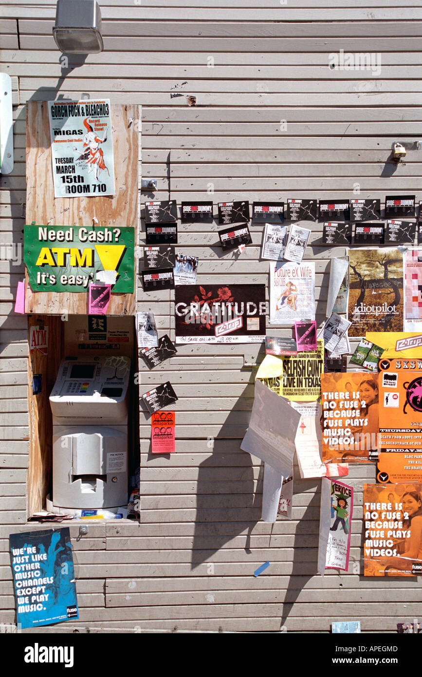 atm machine flyers and posters stuck on a wall Stock Photo - Alamy