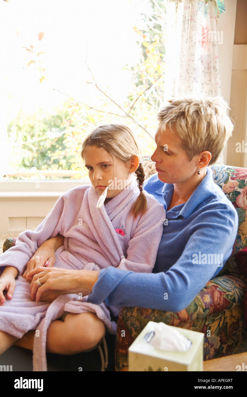 Mother hugging sick daughter Stock Photo - Alamy