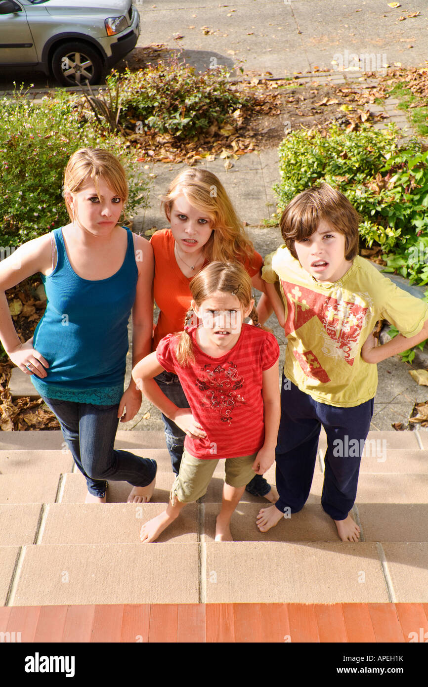 Group of siblings making faces Stock Photo - Alamy