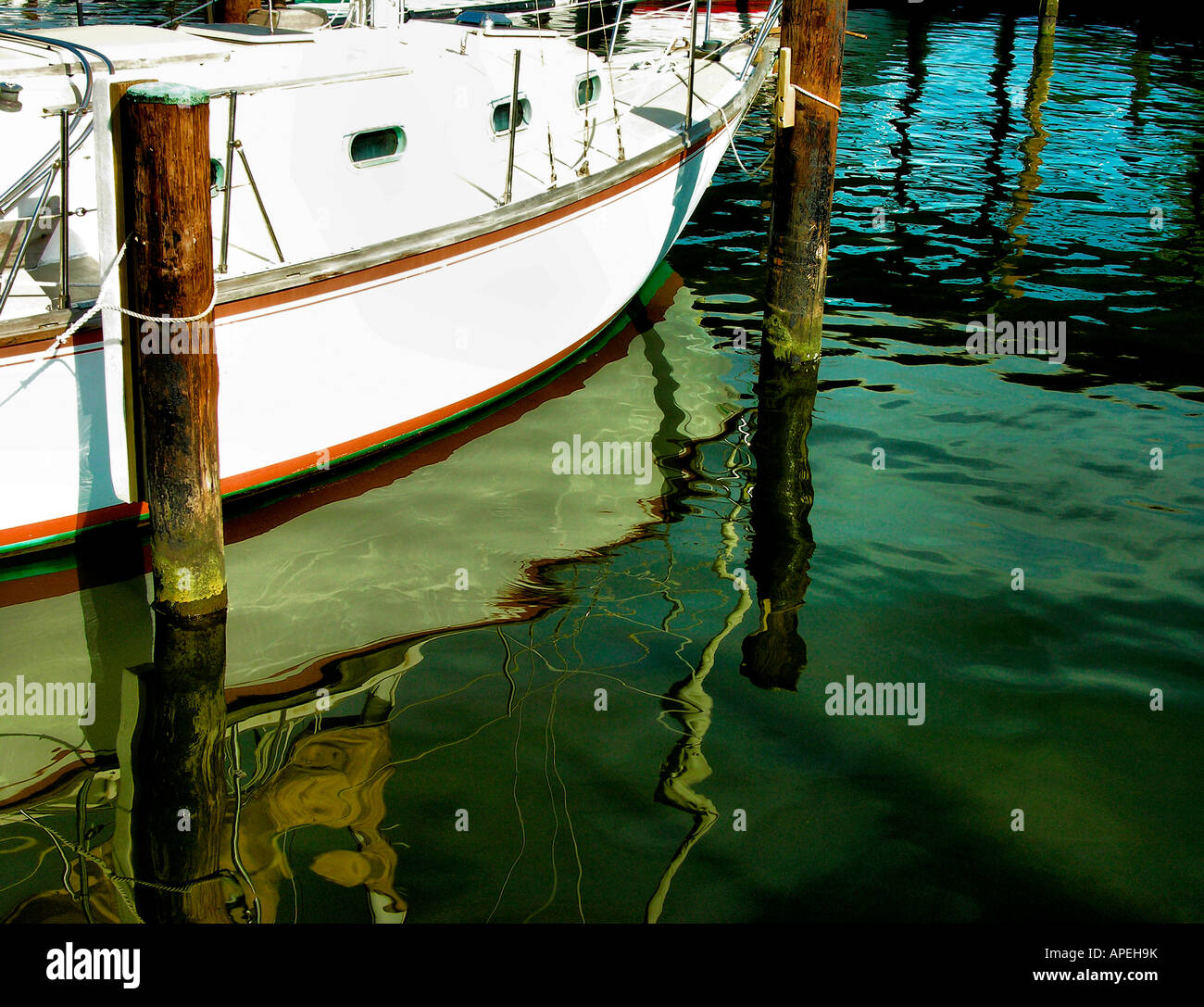 Reflections off the water of a docked boat Stock Photo - Alamy