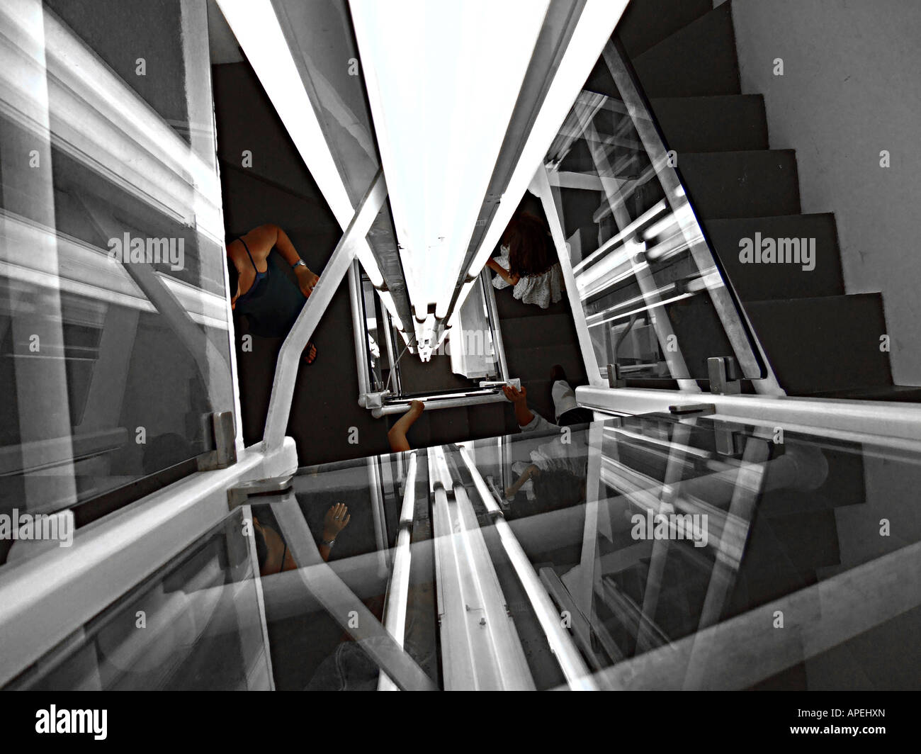 Stairwell with arms along the rails Stock Photo - Alamy