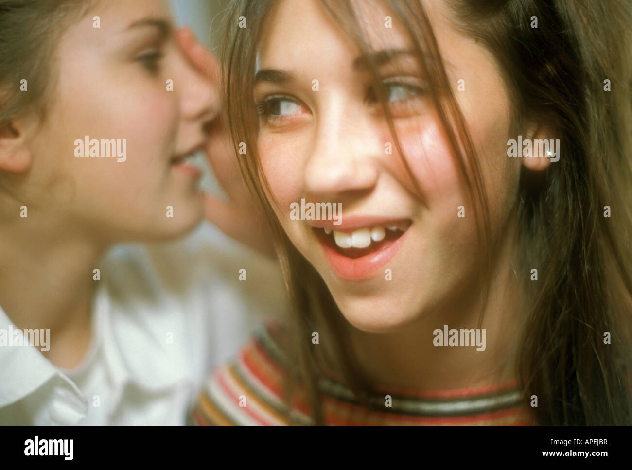 girls whisper secret Stock Photo - Alamy