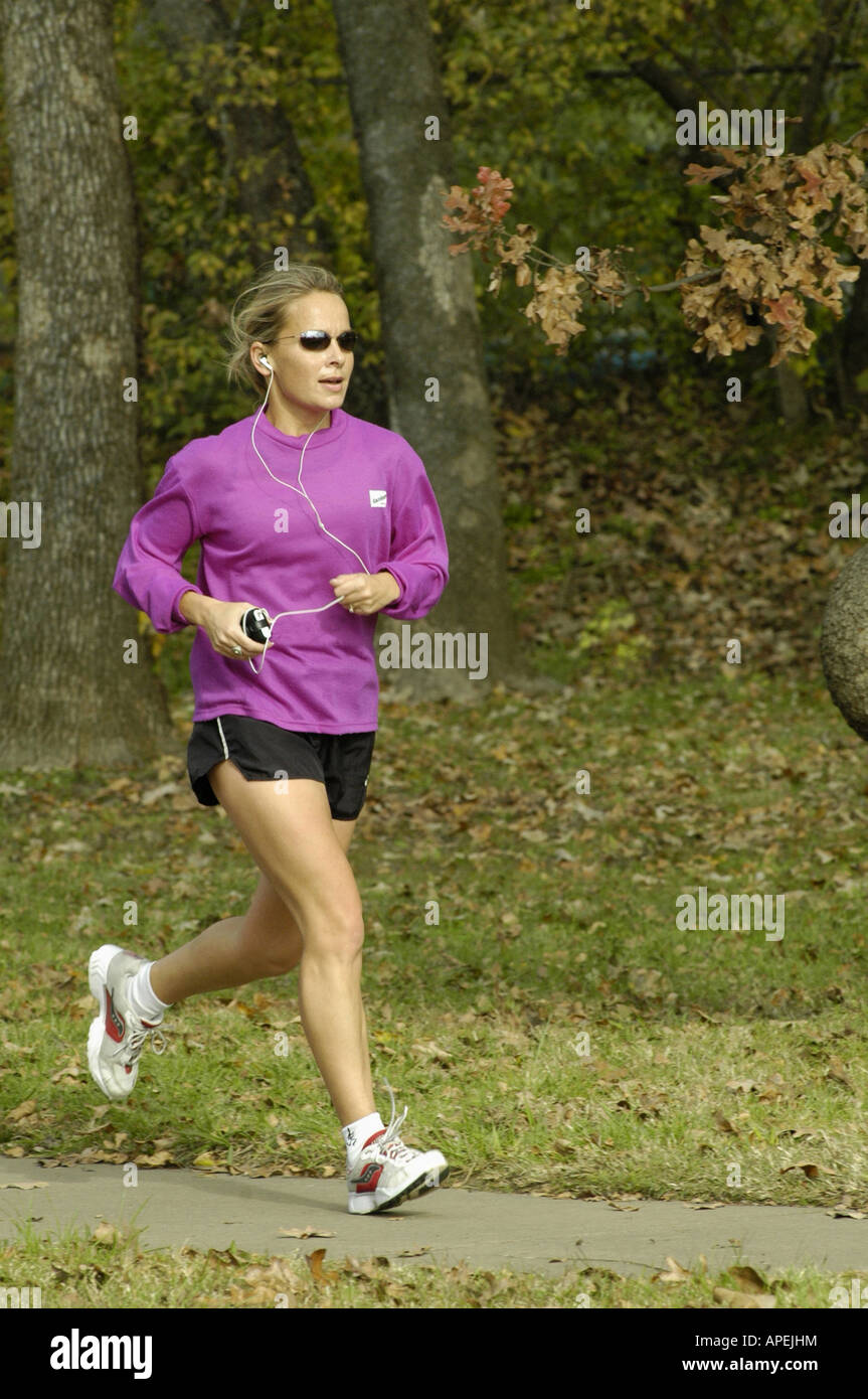 Woman runner earphones on hi-res stock photography and images - Alamy