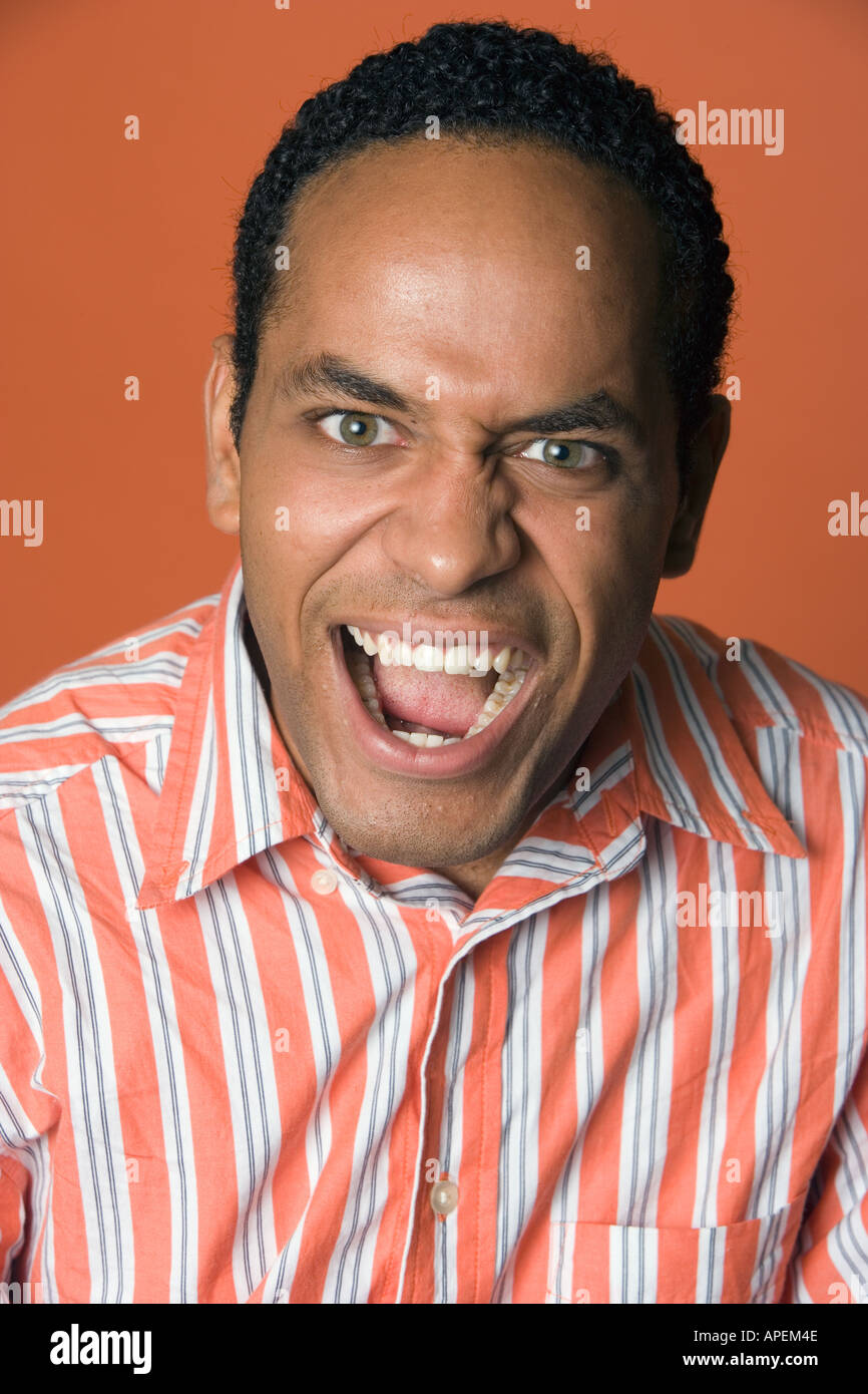 Portrait Latino man yelling Stock Photo - Alamy