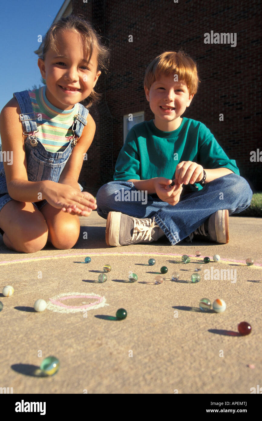 Children playing with marbles Stock Photo - Alamy