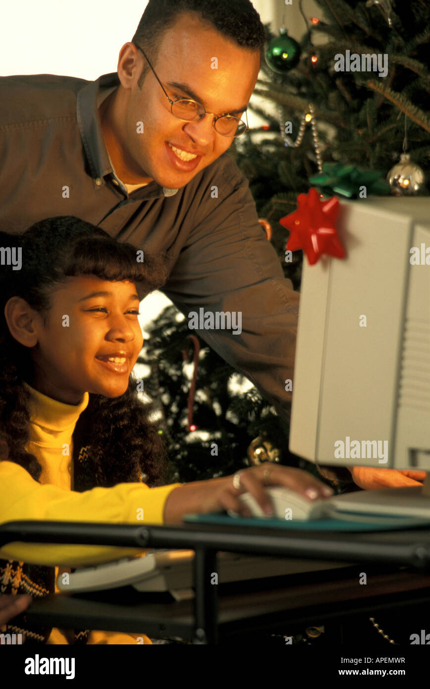 Father & daughter with a computer Christmas present Stock Photo - Alamy